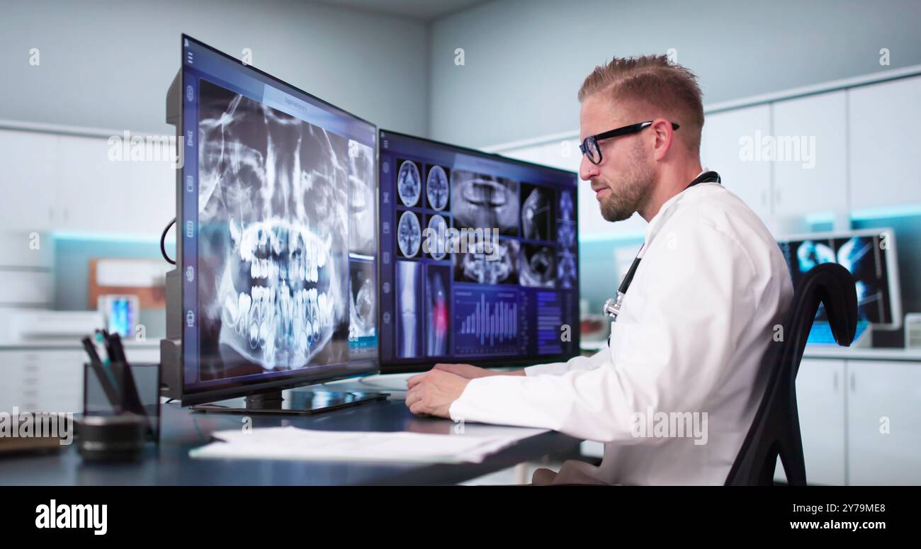 Dentist Doctor Looking At Teeth Xray Using Computer Software Stock ...
