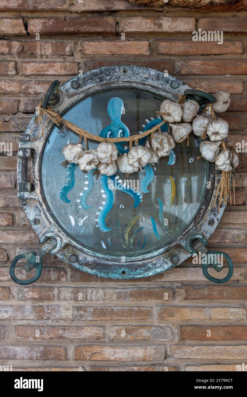 old ships porthole decorated with octopus and seashells, decorative ...