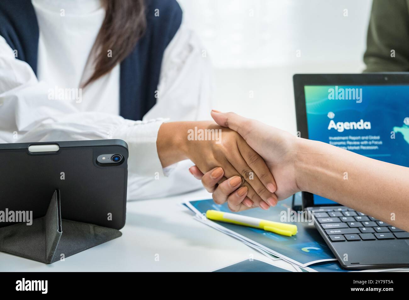 Close up financial officer hand shake deal with business in a meeting ...