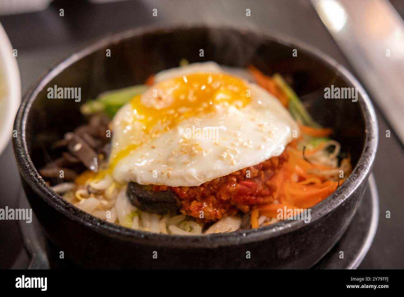 Bibimbap, a Korean rice dish. It is cooked rice mixed with namul ...