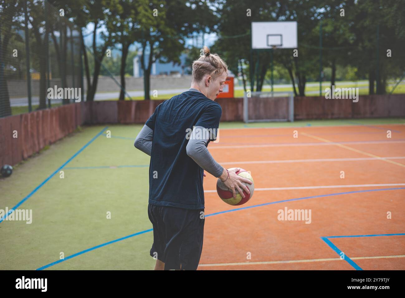 Basketball player controls and dribble the ball during a casual game on ...