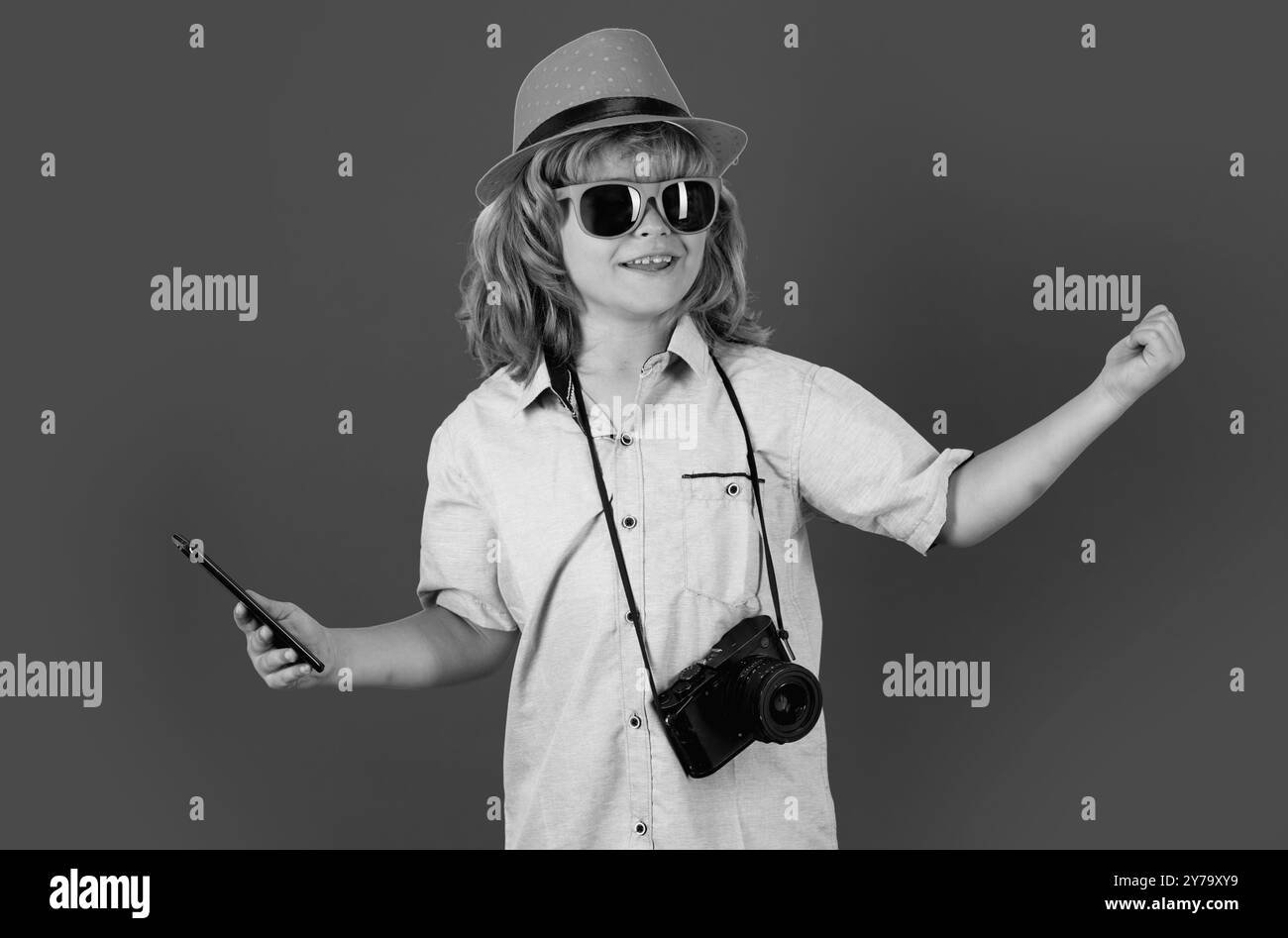 Kid blogger vlogger influencer using mobile phone. Adorable child ...