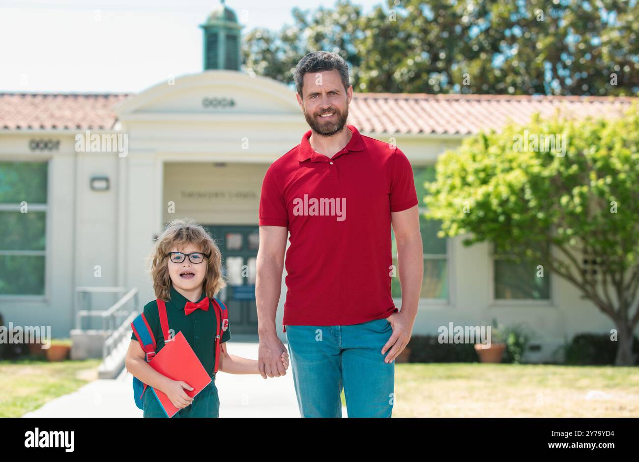 Father and son run with father after come back from school. Child ...
