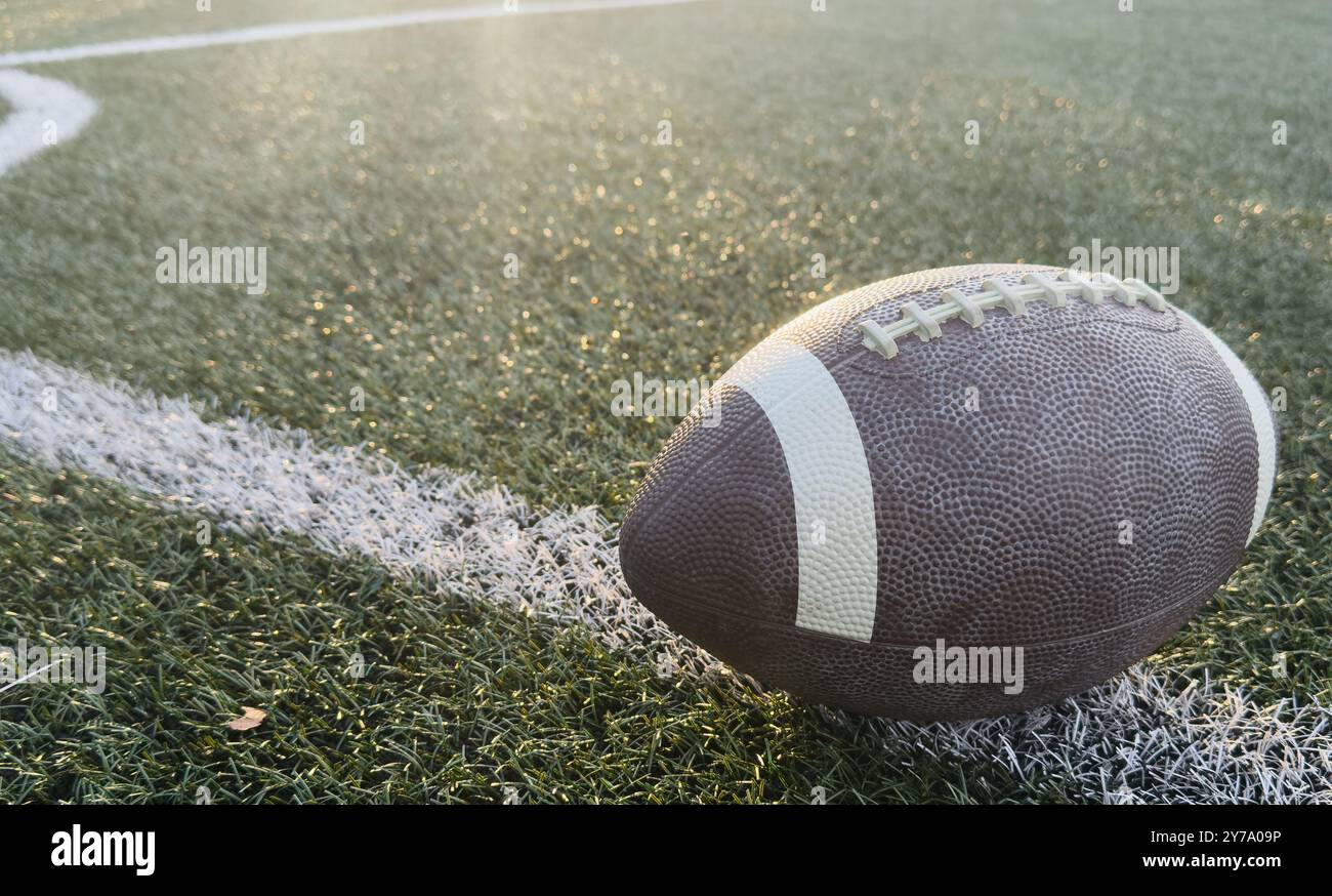 View from above of an American Football sitting on a grass football ...