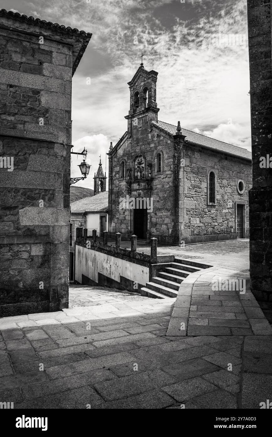 Old stone church with medieval buildings in the city of Tui, black and ...