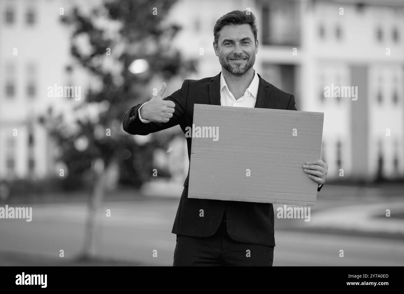 Businessman presenting signboard, billboard or banner. Business man ...