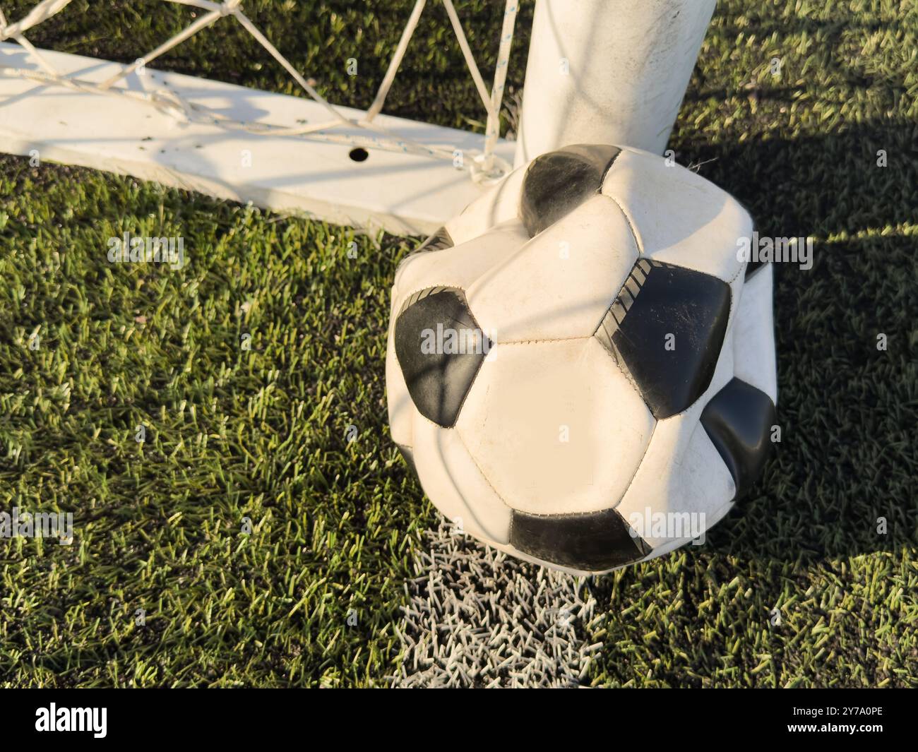 Deflated soccer ball on grass. Soccer concept Stock Photo - Alamy