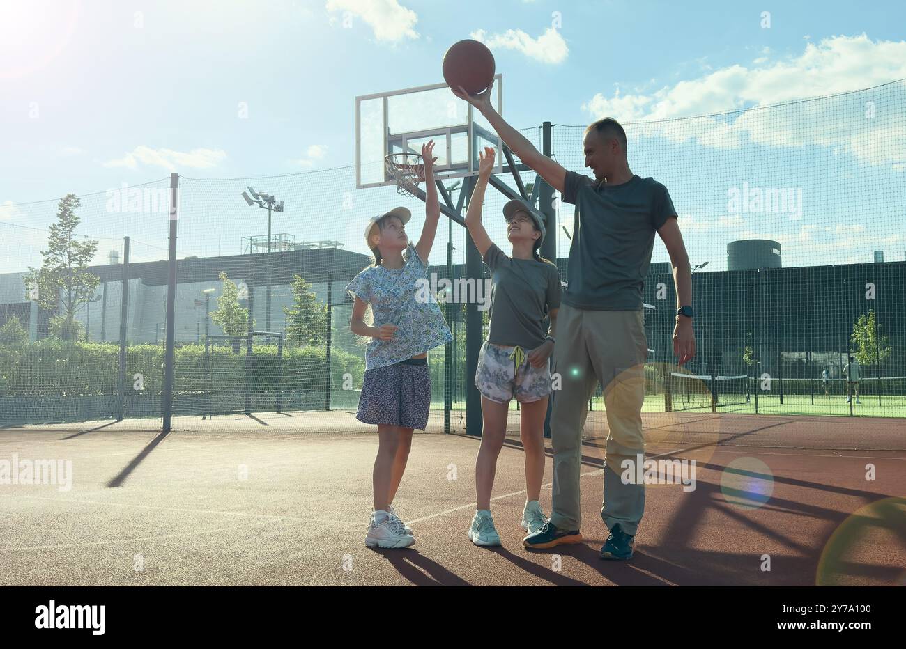 a sports family plays basketball, father, daughters spend free time on ...
