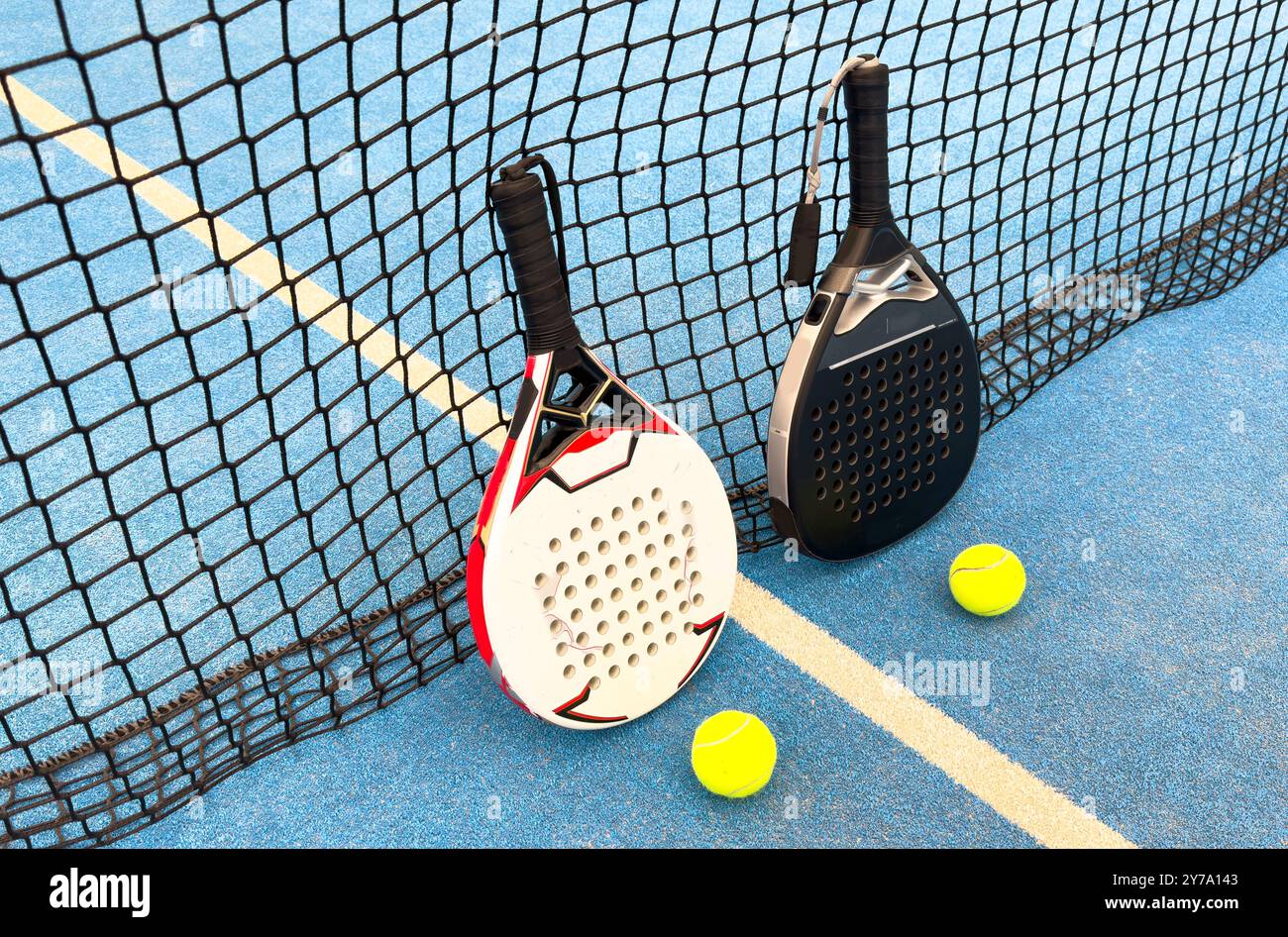 paddle rackets on the playing court Stock Photo - Alamy