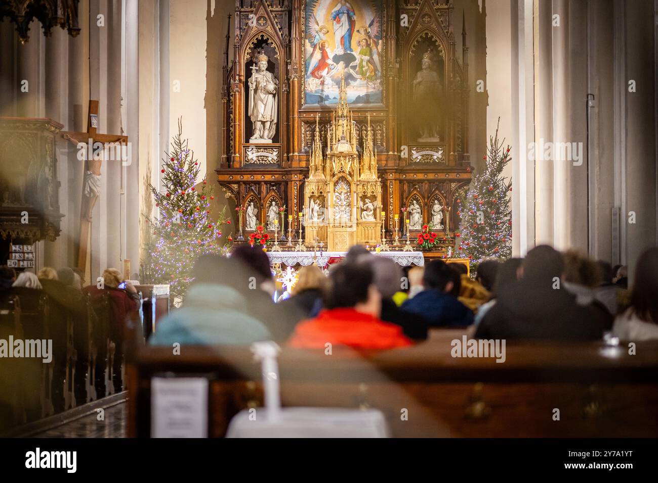Church altar during Christmas Mass with The Nativity scene. Back view ...