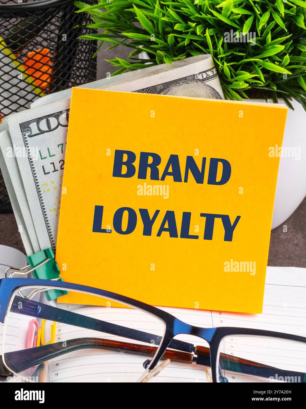 Conceptual brand loyalty symbol. Copy space. BRAND LOYALTY on a yellow ...