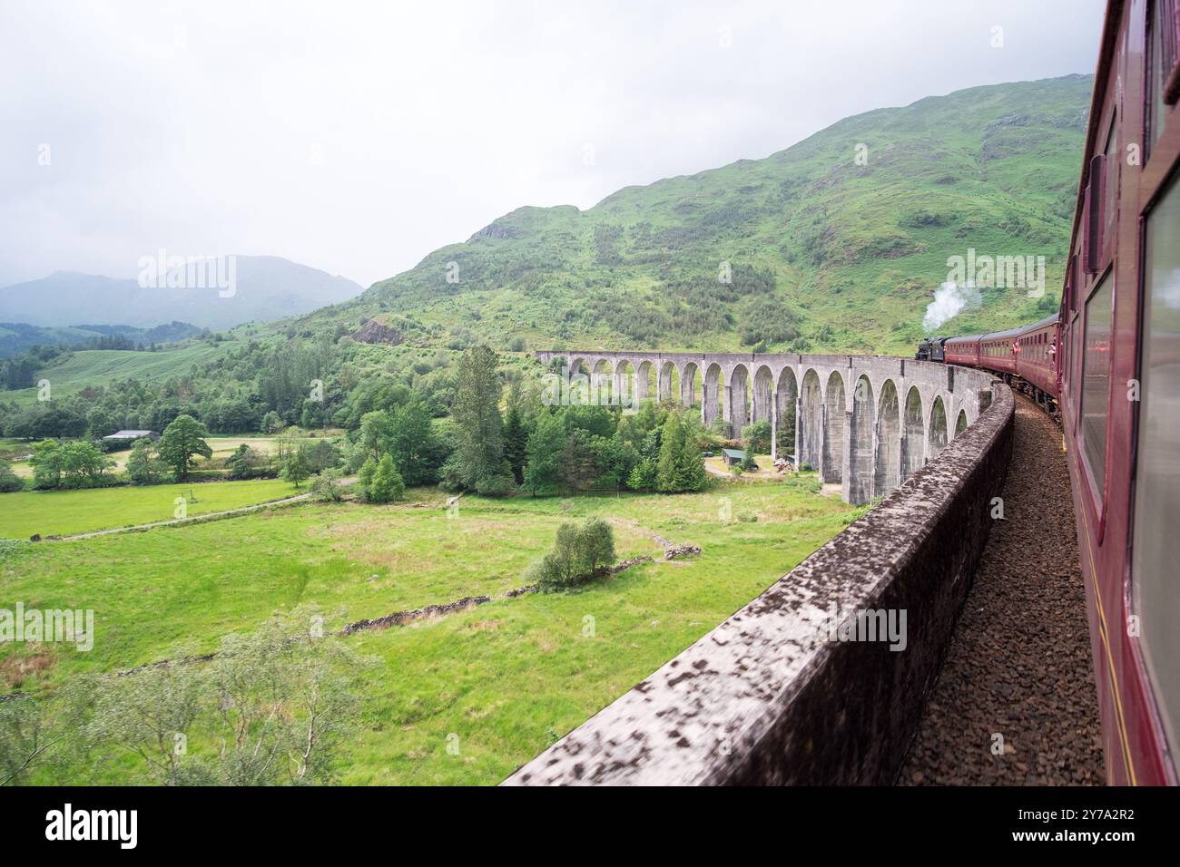 Jacobite Steam Train Locomotive passing Glenfinnan Viaduct Stock Photo ...