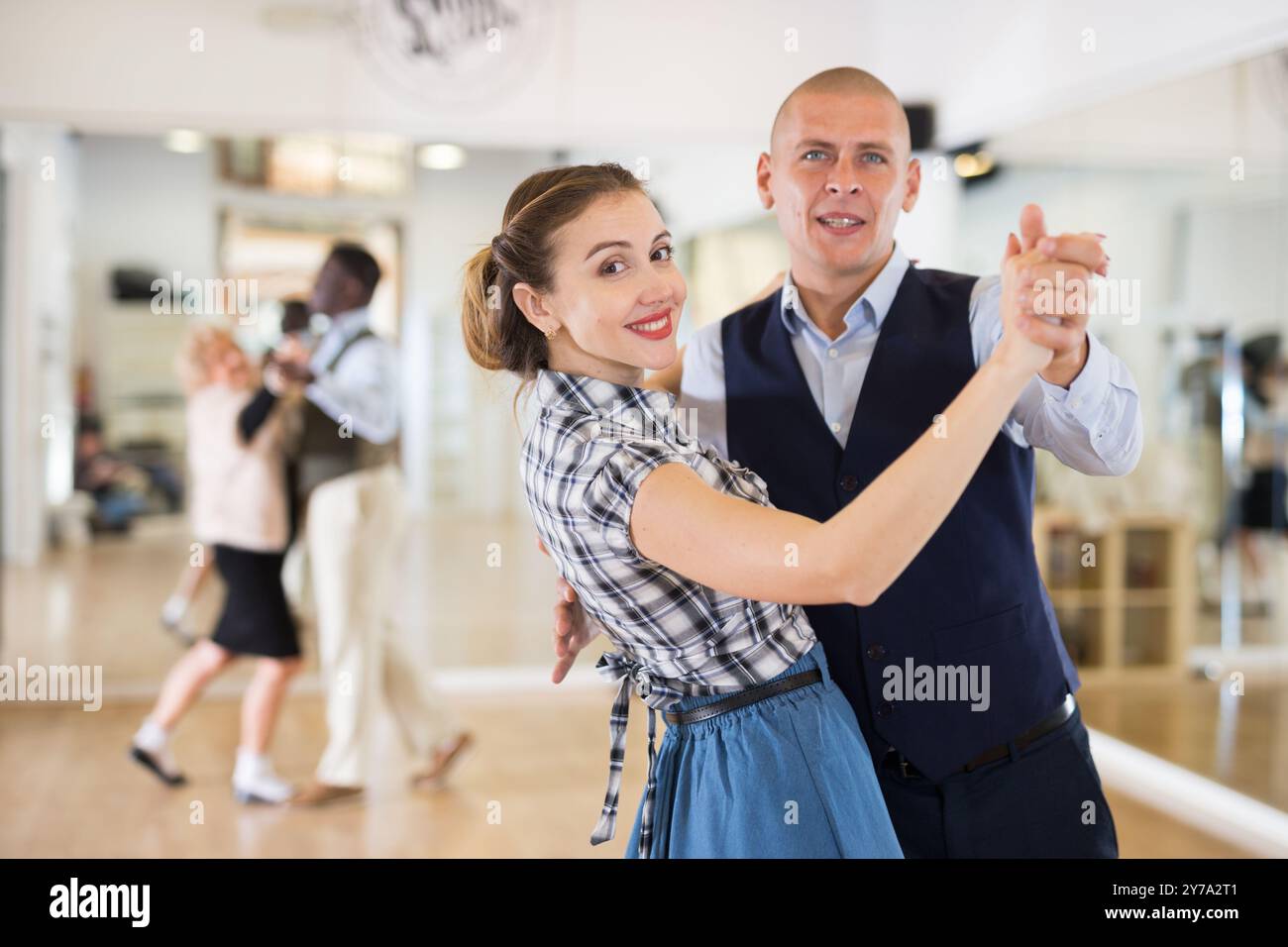 Happy man and woman enjoying ballroom dancing Stock Photo - Alamy