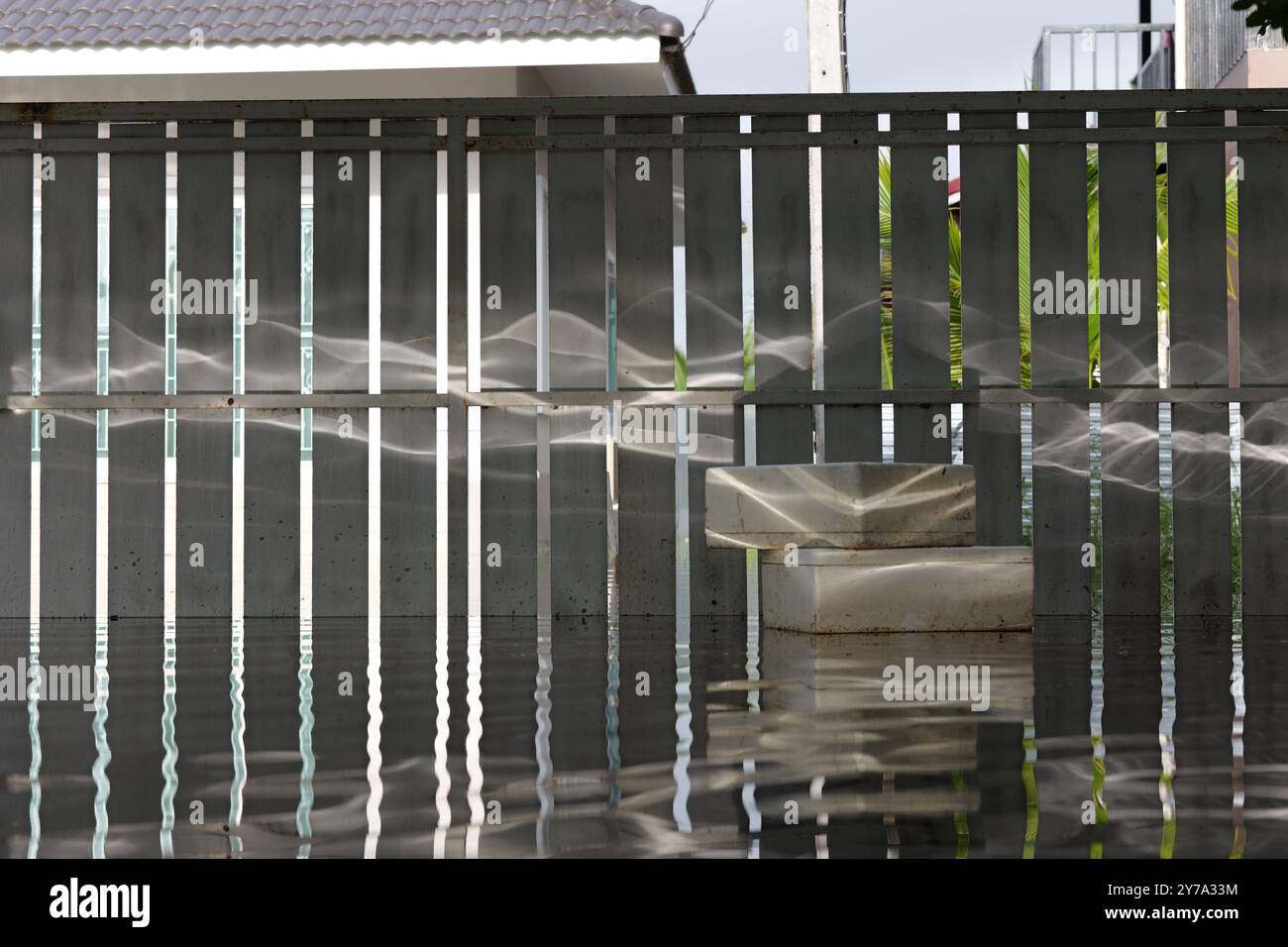 Floodwaters at the front gate, foam boxes floating on the surface, and ...