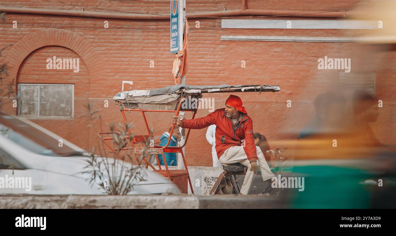 New Delhi, Delhi, India. Indian man carries loaded cargo on a cargo ...
