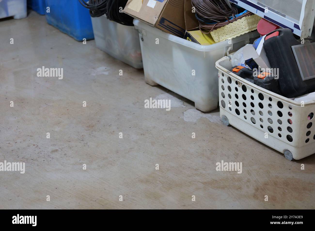 Water spreading. flooding on storage room concrete floor in a house ...