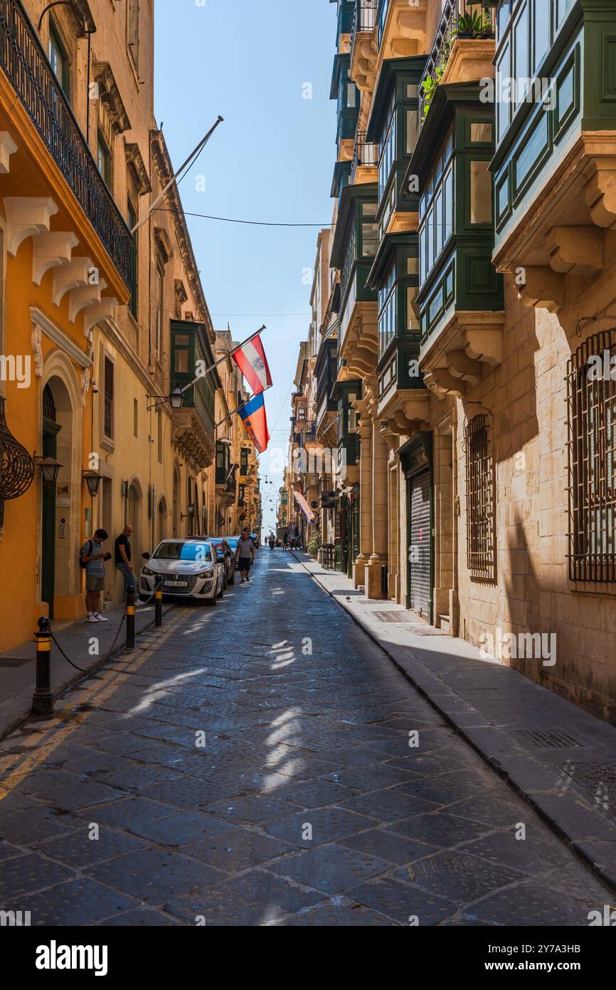 VALLETTA, MALTA - AUGUST 30 2024: Narrow street in Valletta with ...