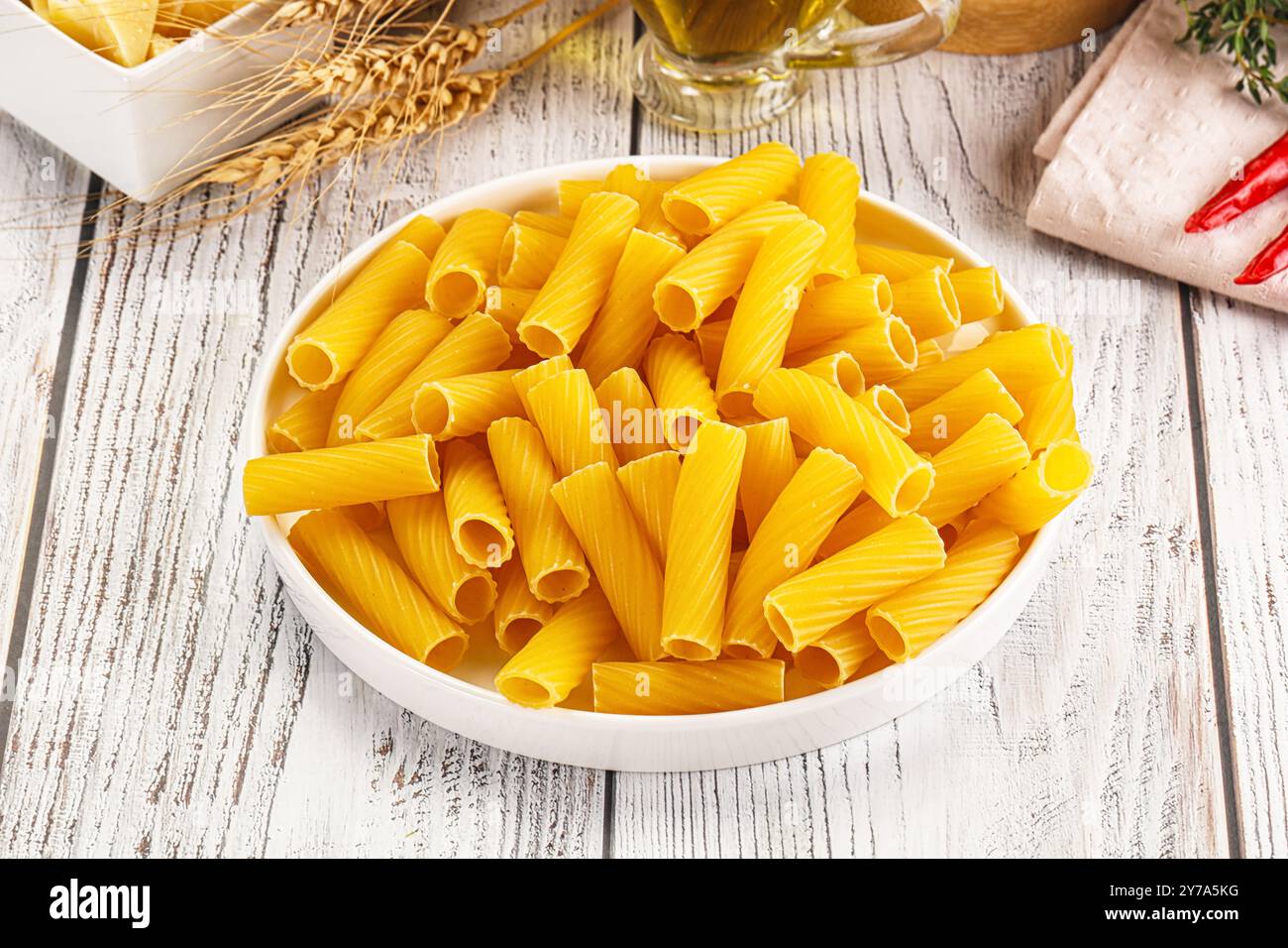 Italian cuisine - raw dry tortiglioni pasta Stock Photo - Alamy