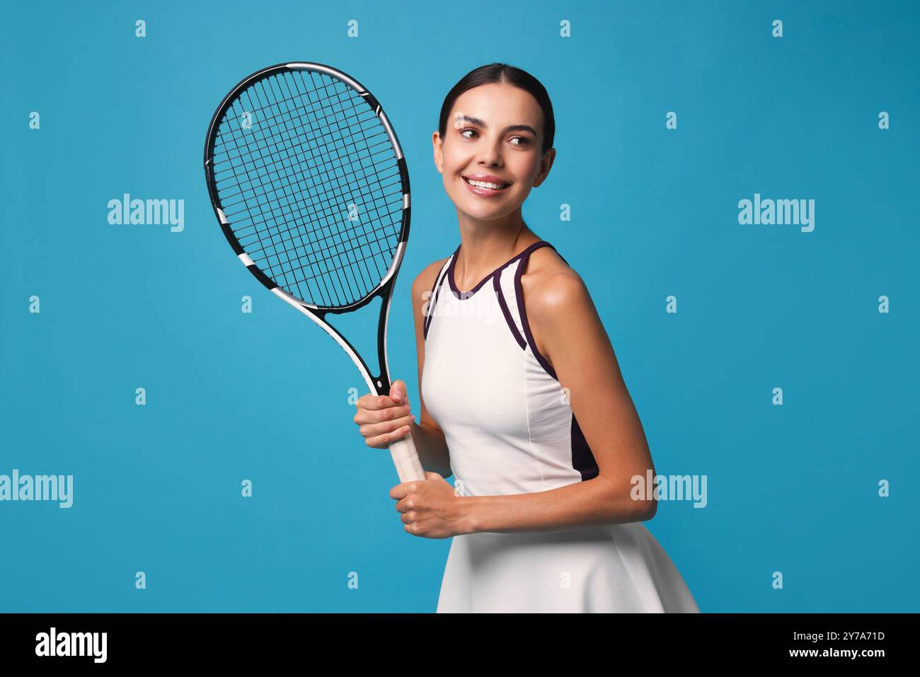 Beautiful young woman with tennis racket on light blue background Stock ...