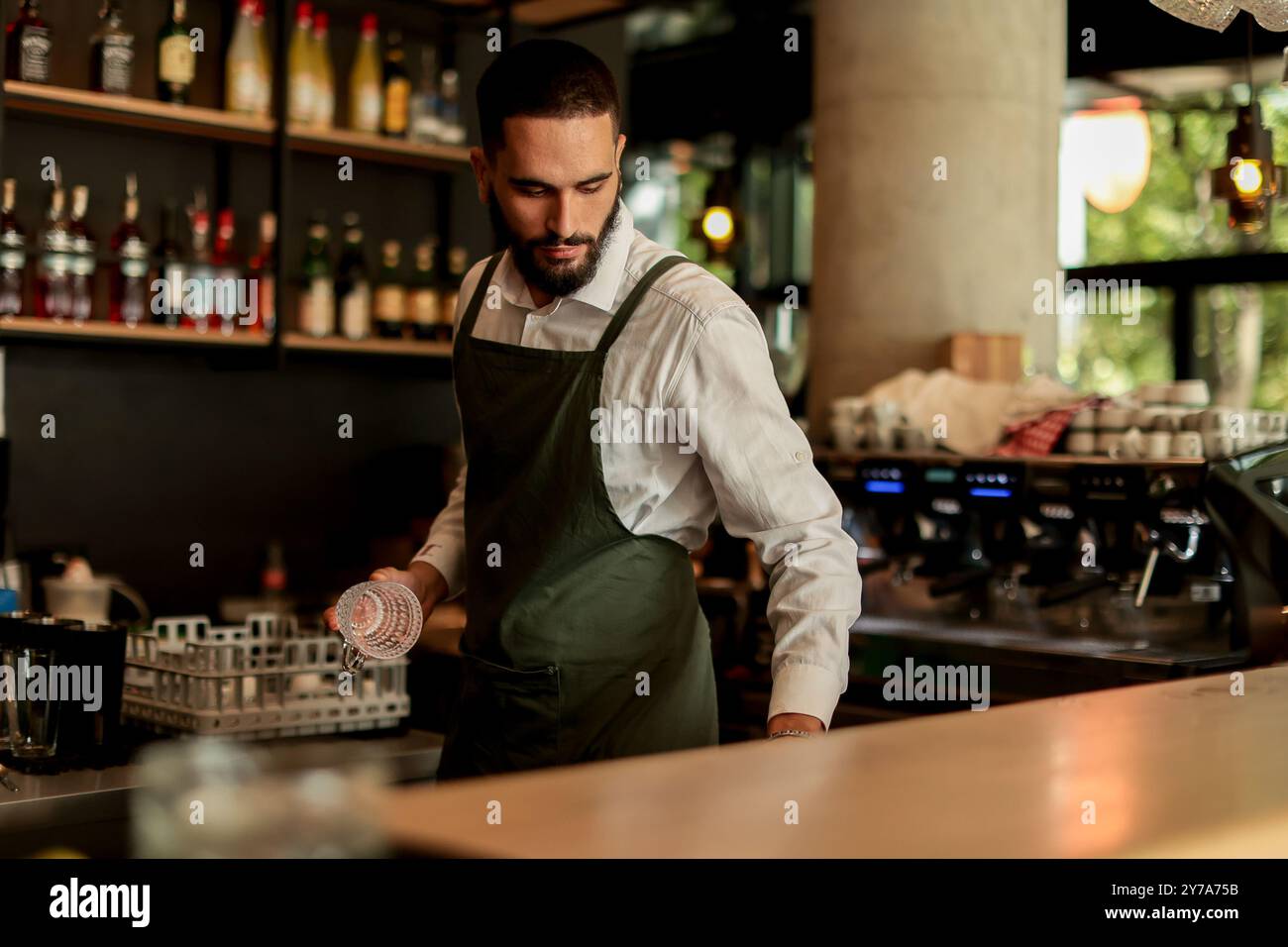 Bartender serving drinks in lively hi-res stock photography and images ...