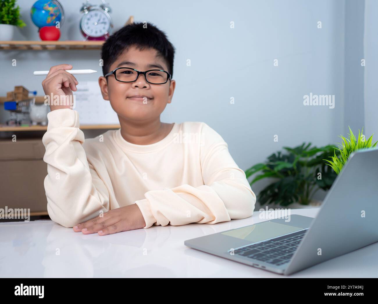 Little Asian boy student using computer laptop learning. Educational of ...