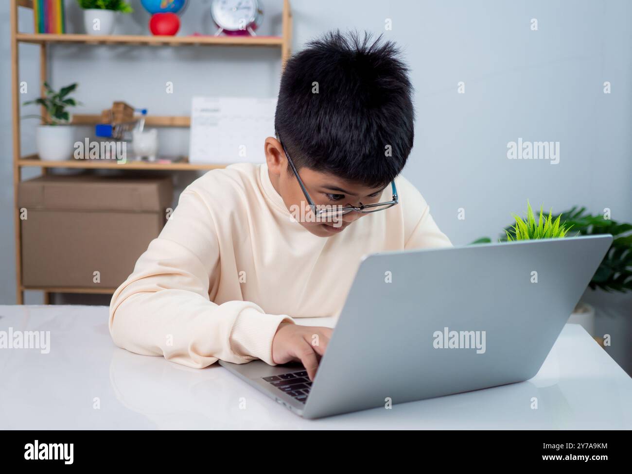 Educational of tech concept, Staying at home, Little Asian boy student ...