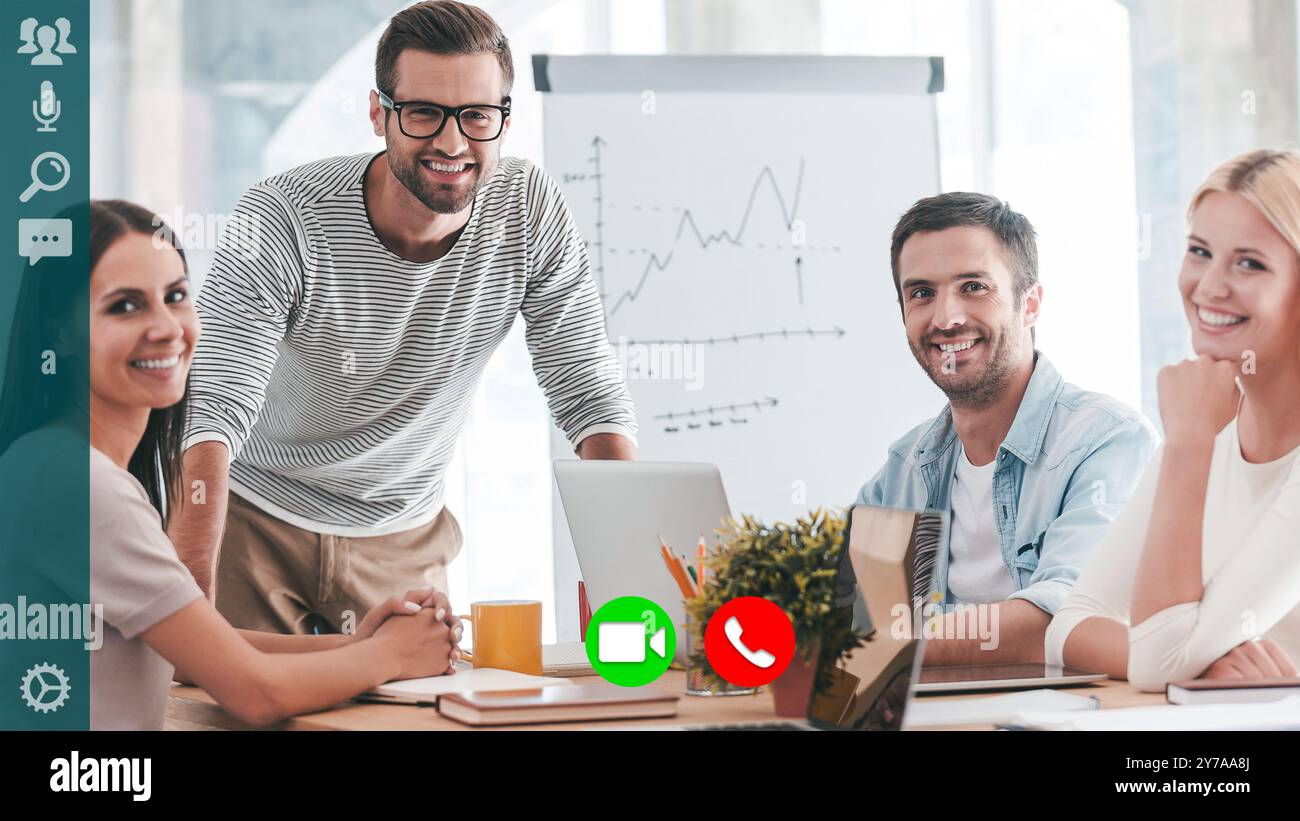 Group of coworkers smiling and communicating together while conducting ...