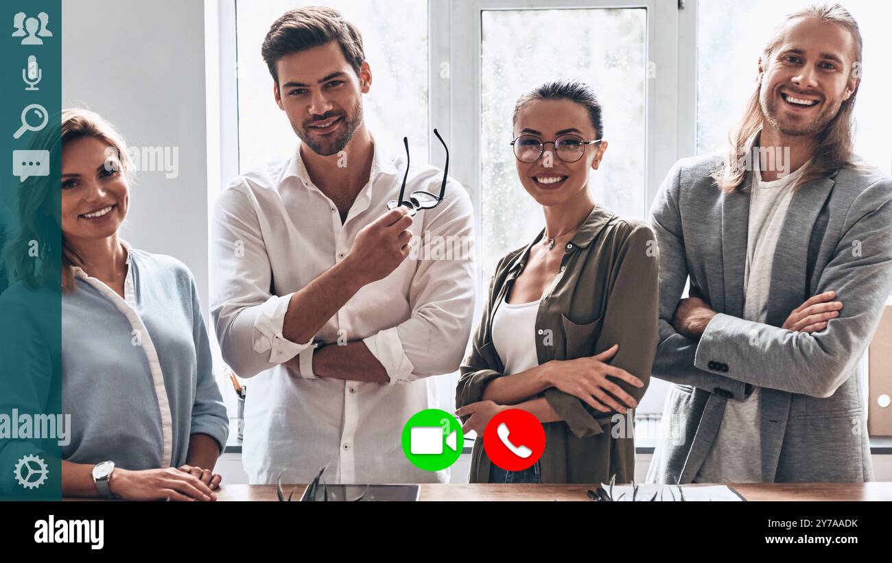 Group of coworkers smiling and communicating together while conducting ...