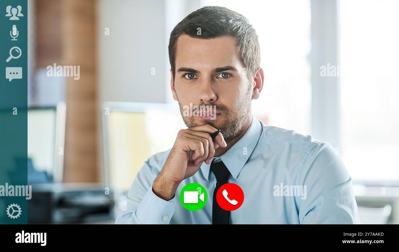 Good looking young man in formalwear looking at camera and keeping hand ...