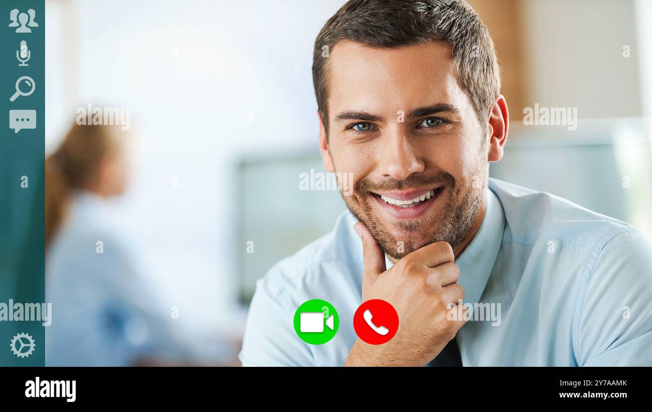 Good looking young man in formalwear looking at camera and keeping hand ...