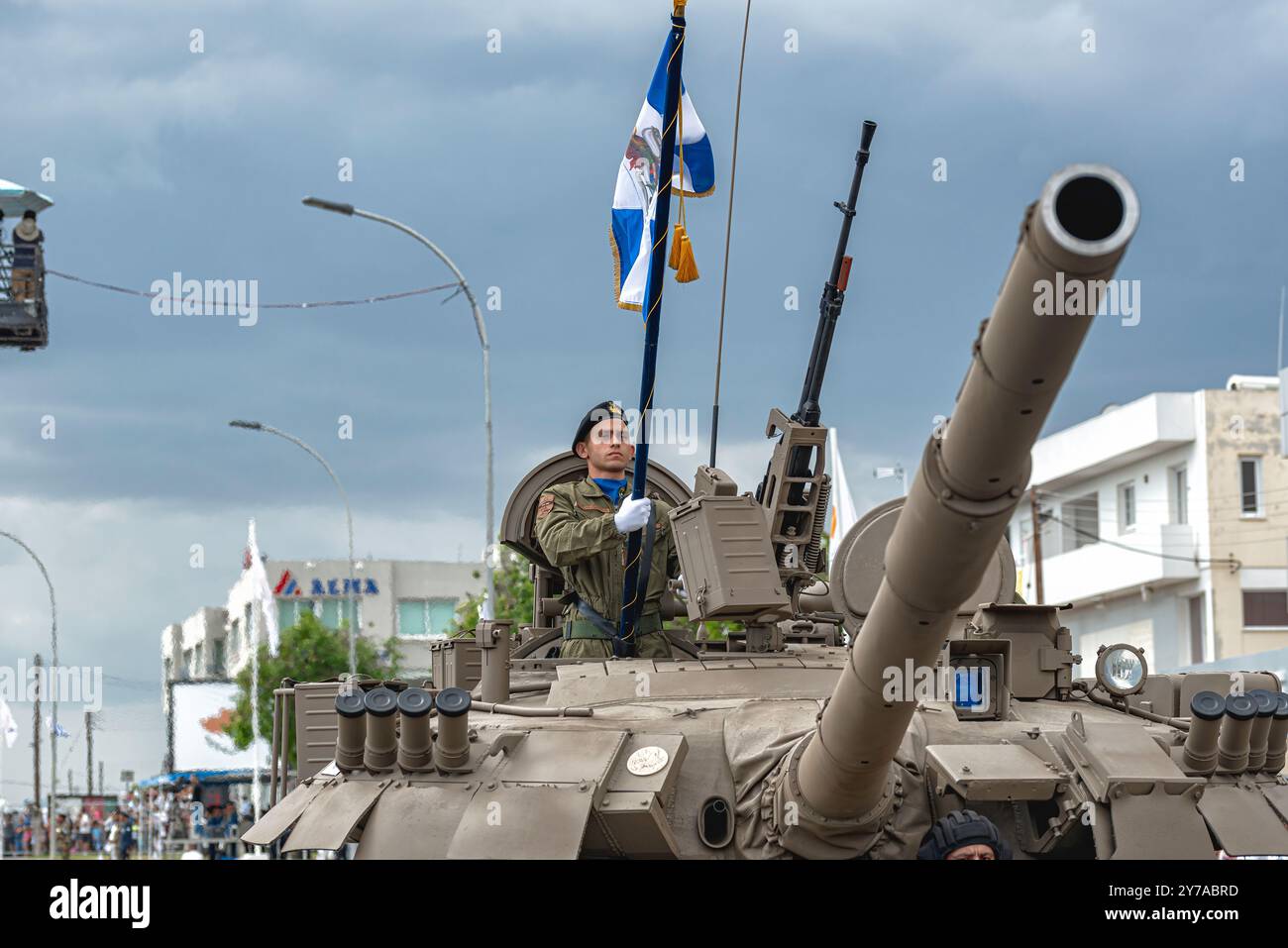 Nicosia, Cyprus - October 01, 2023: Soldier is holding the Cypriot flag ...