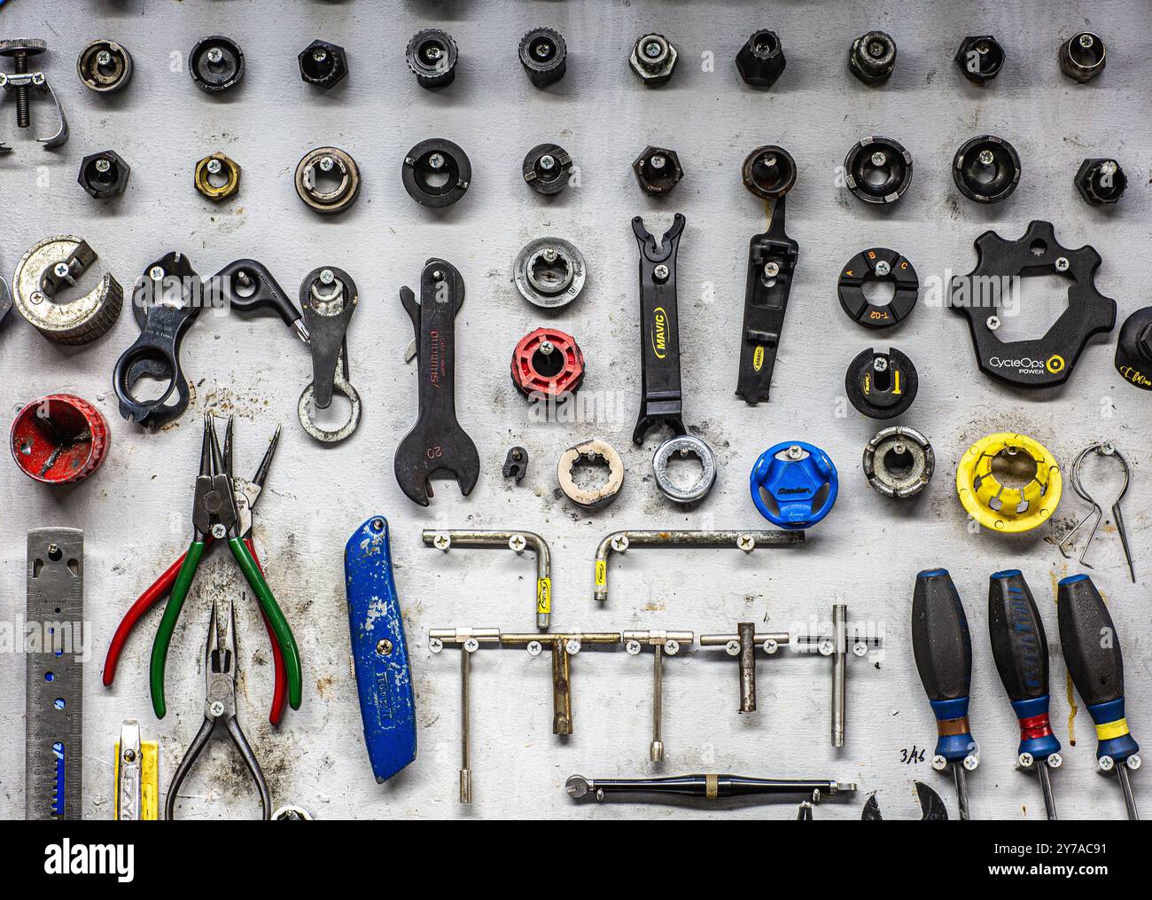 Mechanic tools hanging on a wall Stock Photo - Alamy