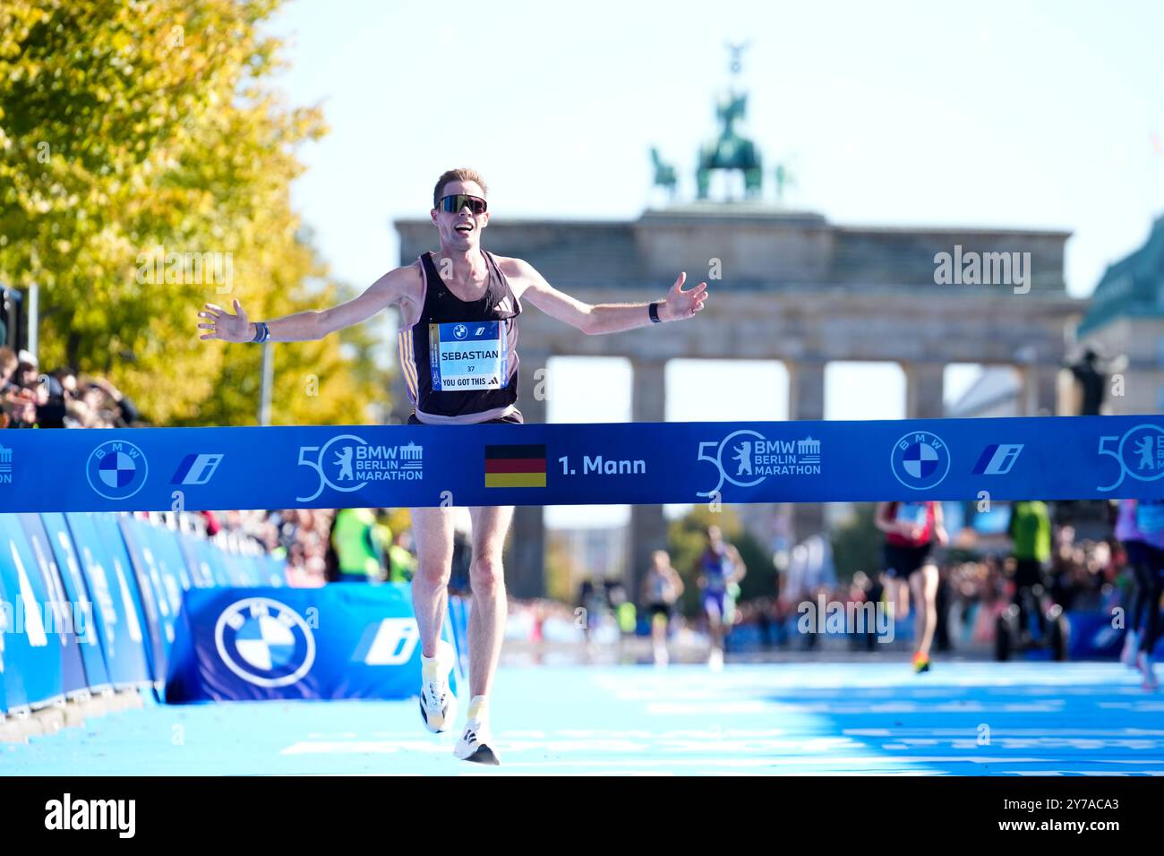 Sebastian Hendel from Germany celebrates as he crosses the finish line ...