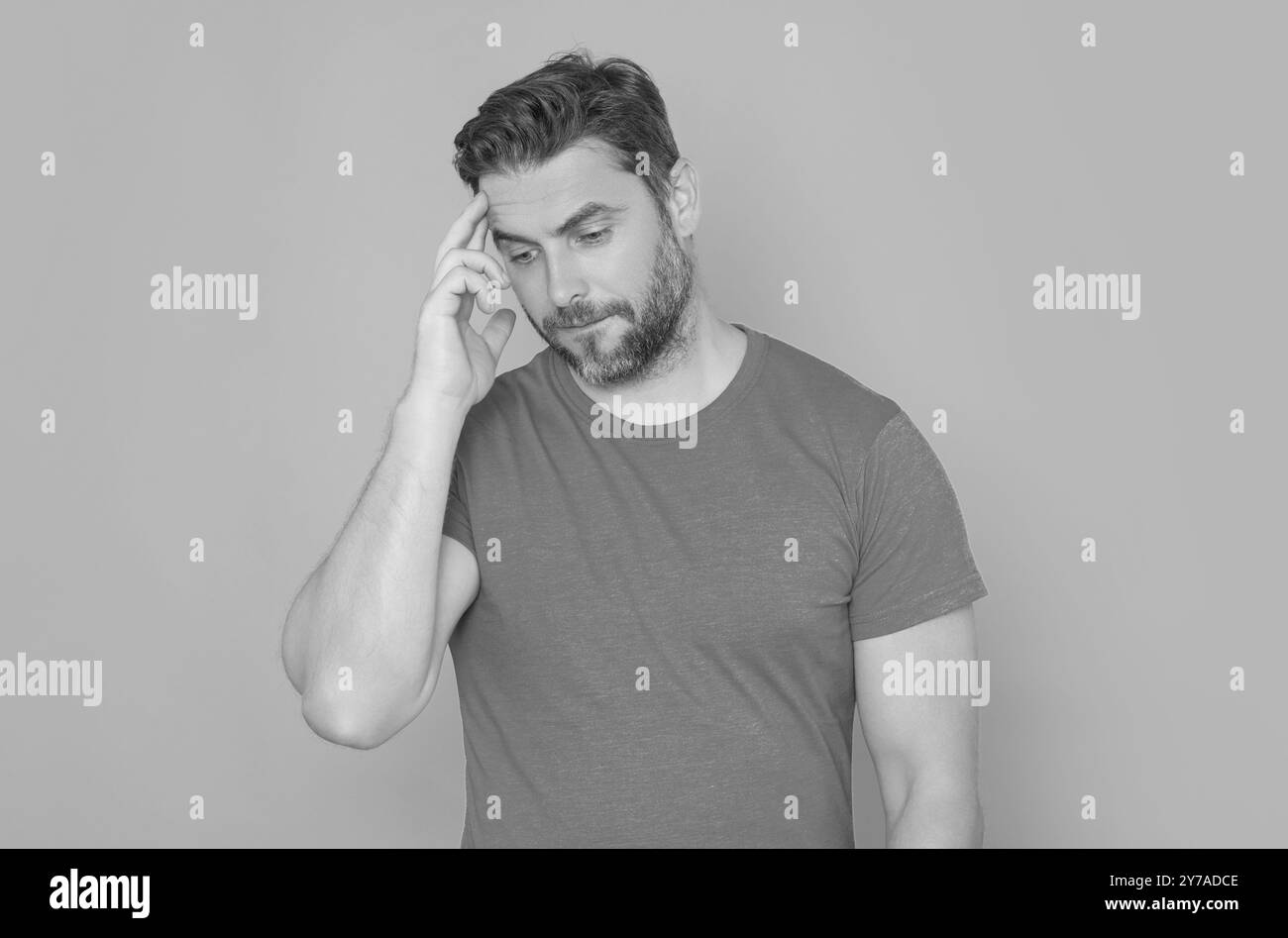 Pensive man isolated on studio background thinking. Thoughtful man ...