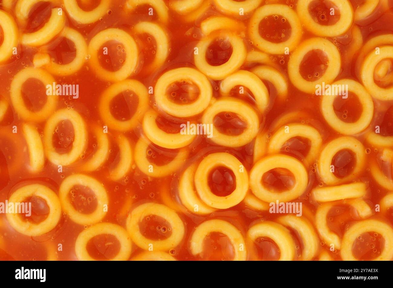 Spaghetti hoops in a juicy tomato sauce food background Stock Photo - Alamy