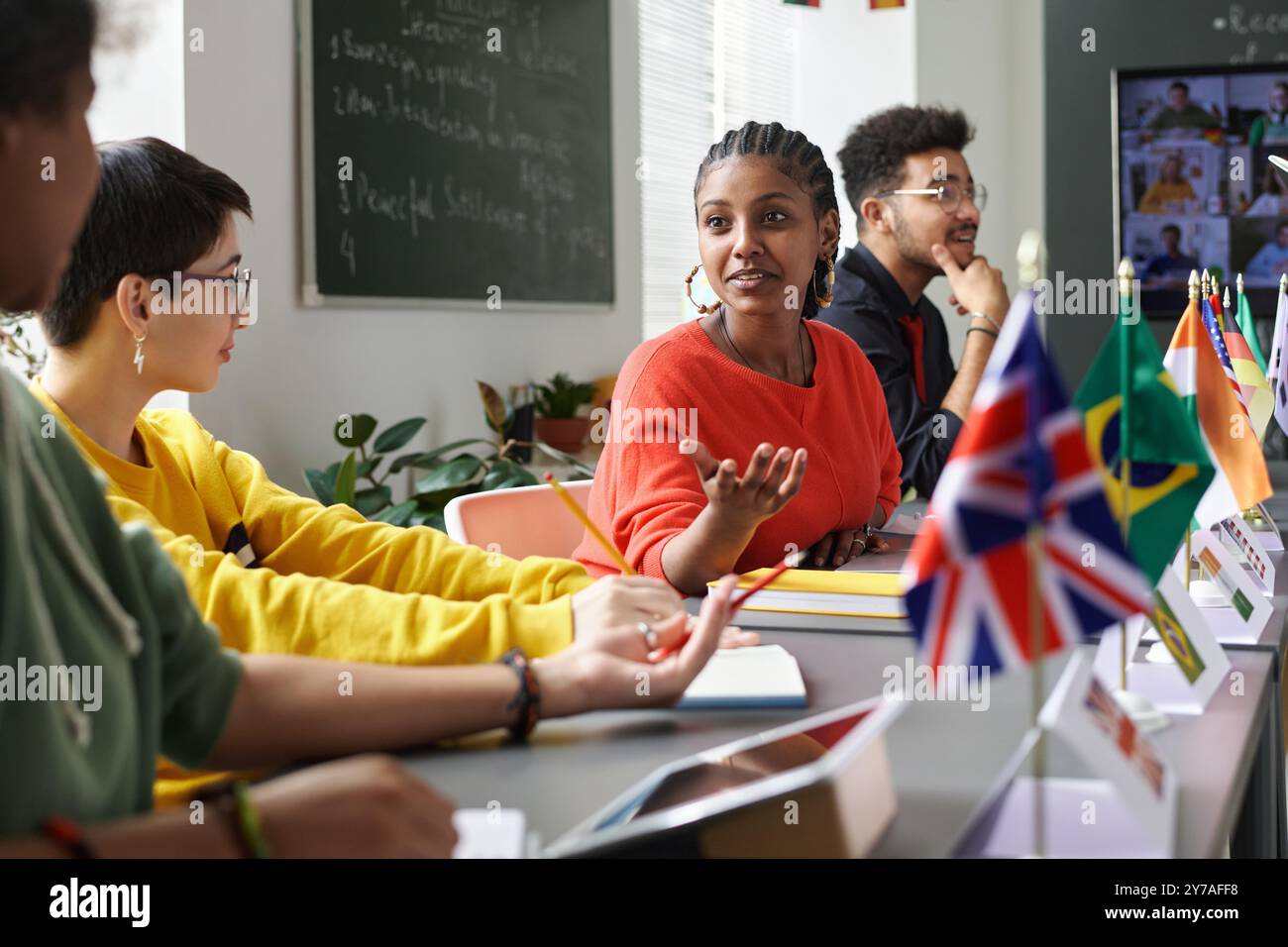 Multicultural Students Chatting in Class Stock Photo - Alamy