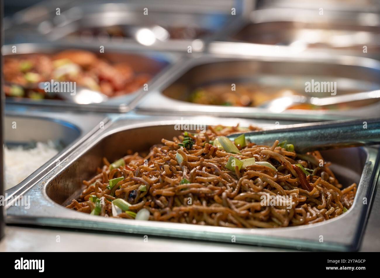 Asian food buffet in restaurant multiple food dishes and salad. Eat as ...