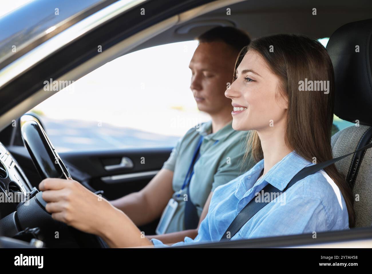 Driving school. Student passing driving test with examiner in car Stock ...