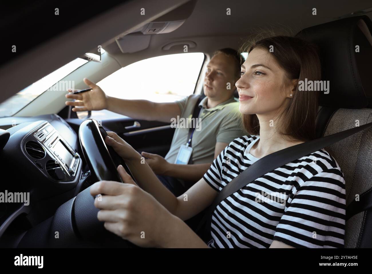 Driving school. Student passing driving test with examiner in car Stock ...
