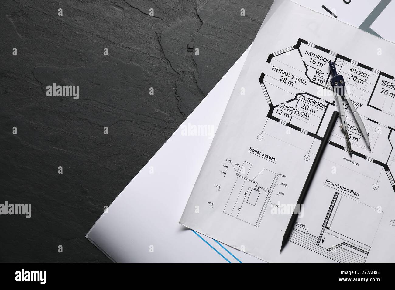 Different engineering drawings, pencil and divider on grey textured ...