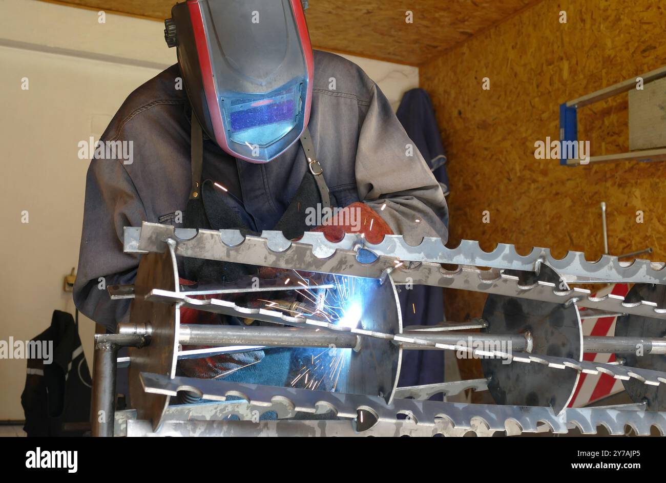 Welder in red protective hi-res stock photography and images - Alamy