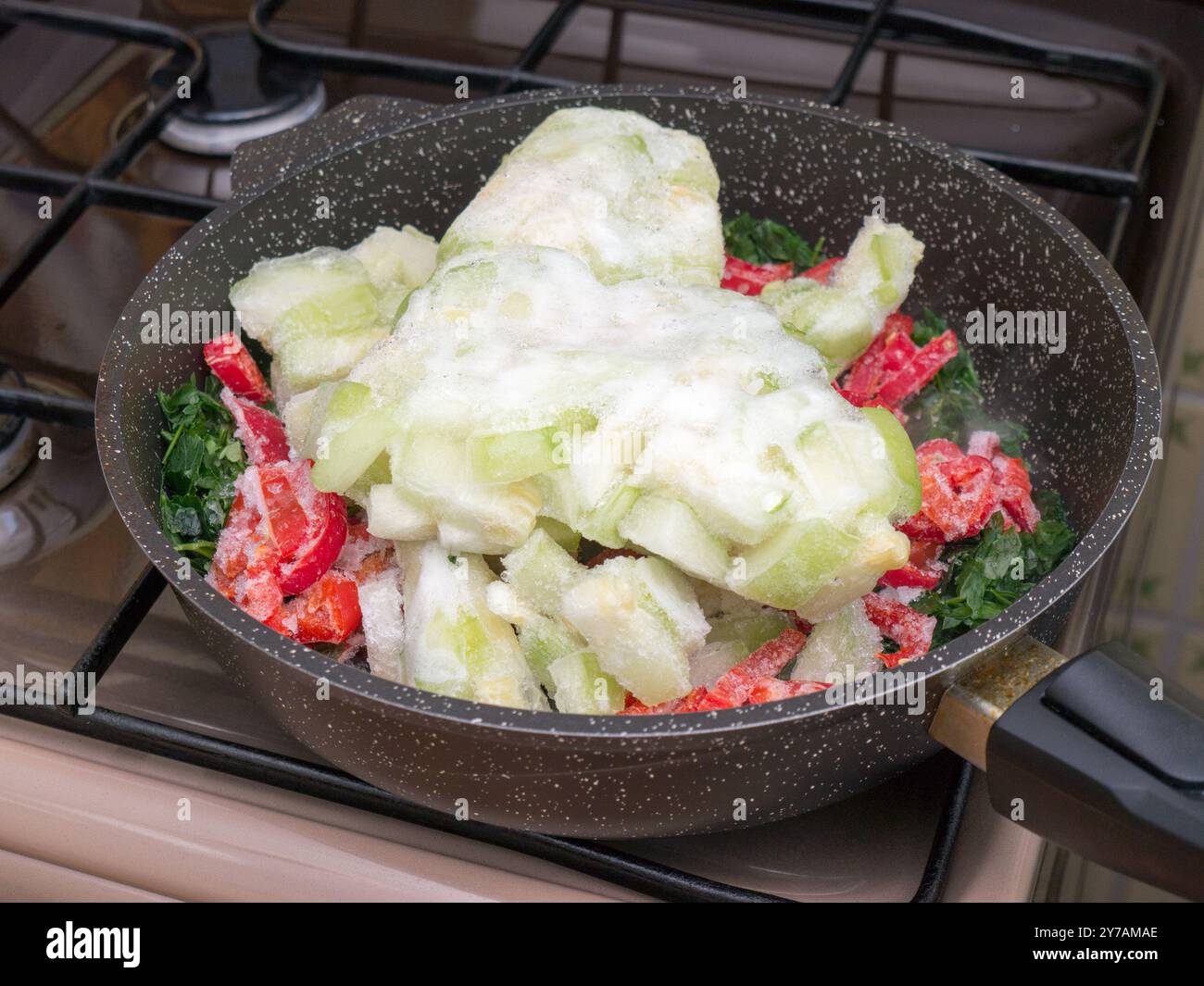 Frozen vegetables in a frying pan Stock Photo - Alamy