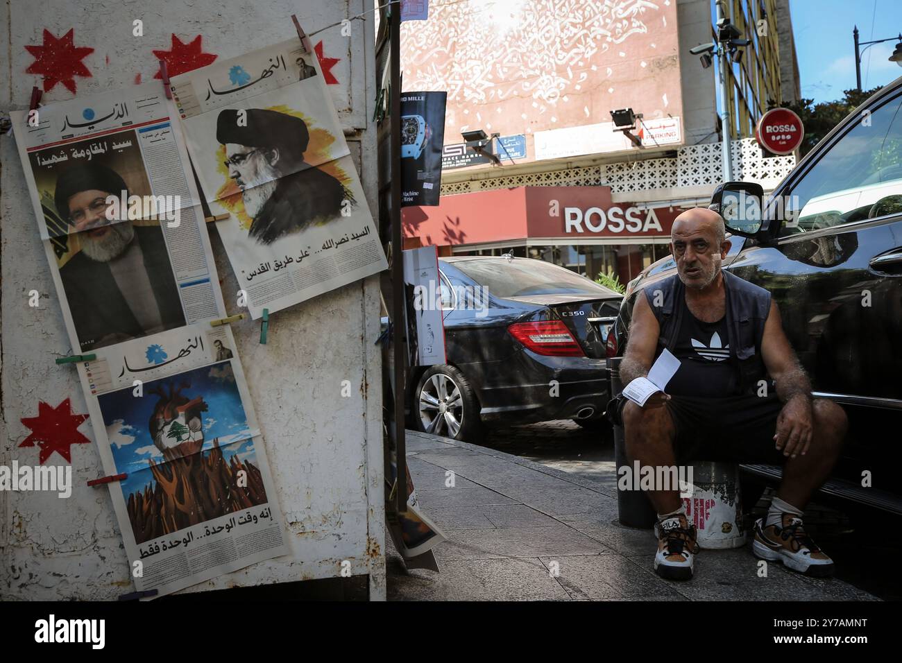Beirut, Lebanon. 29th Sep, 2024. A sweepstake seller sits near ...