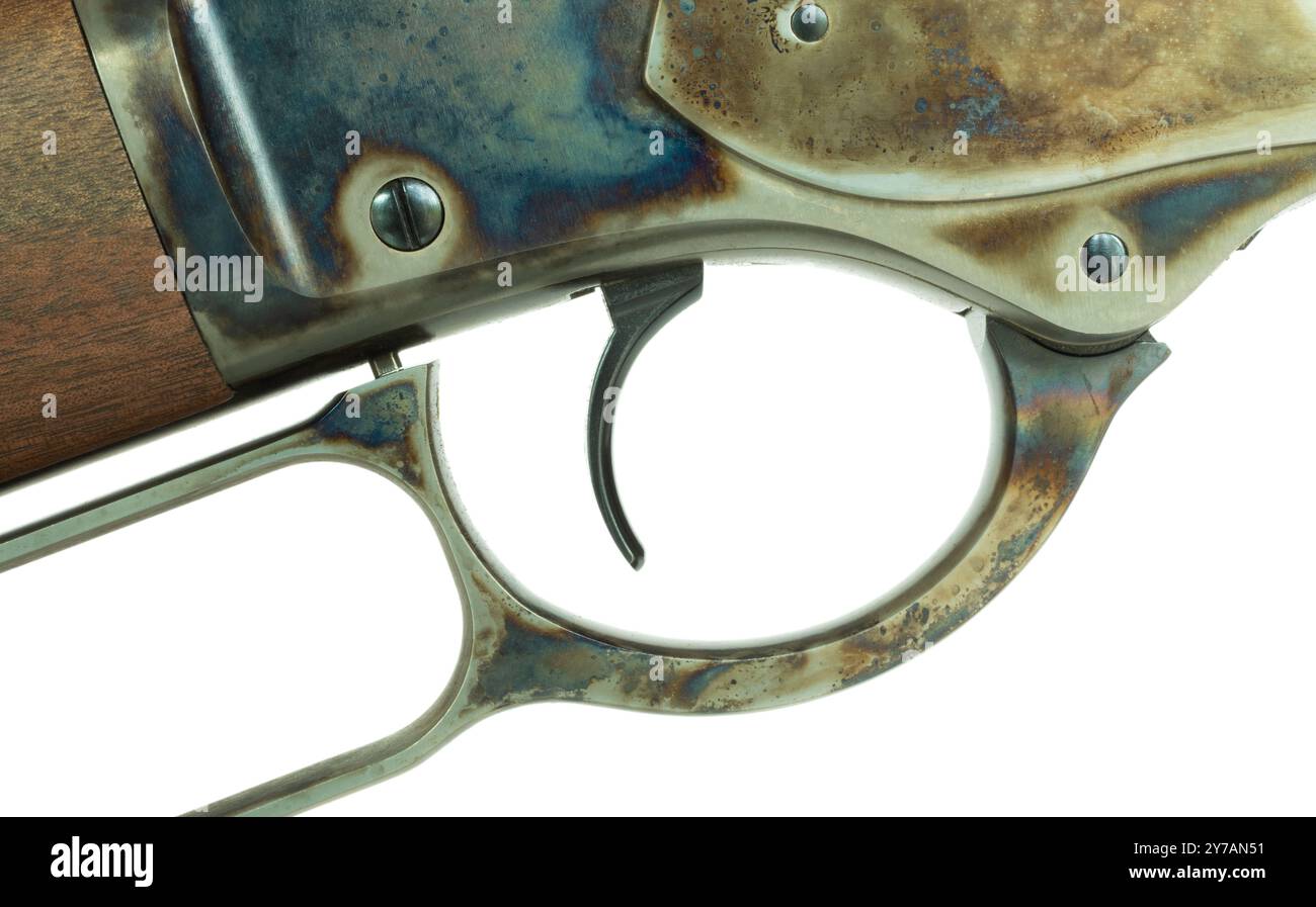 Color-casehardened lever action rifle close up at the trigger and lever ...