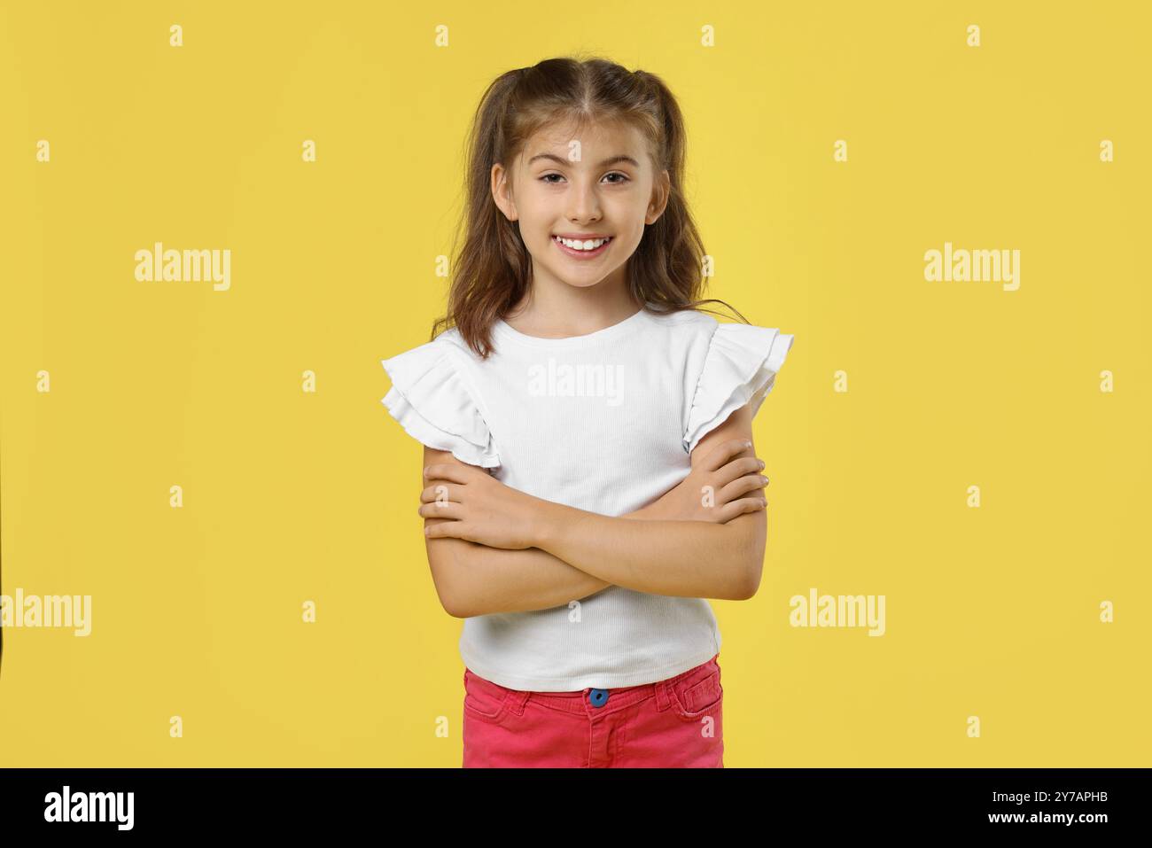 Portrait of cute girl on yellow background Stock Photo - Alamy