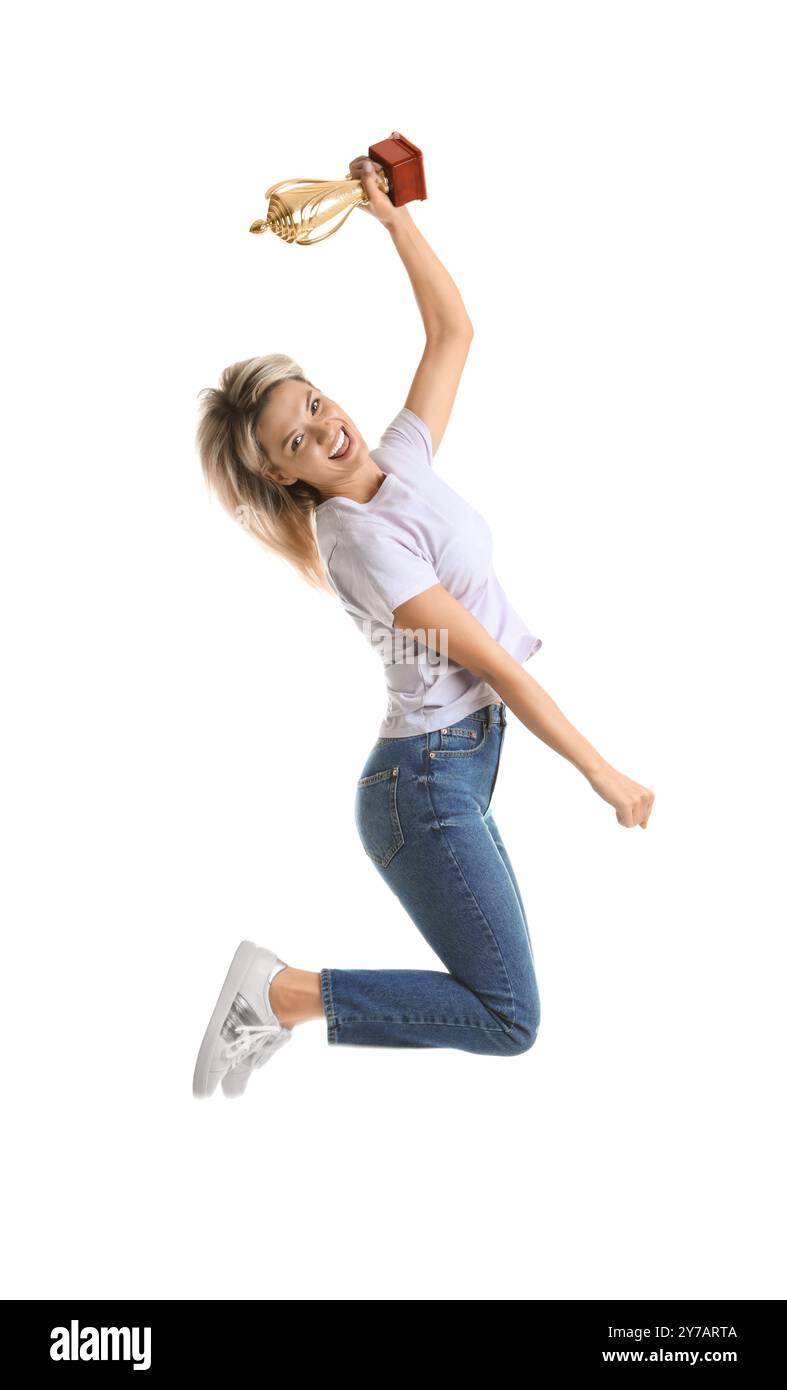 Happy winner with golden trophy cup jumping on white background Stock ...