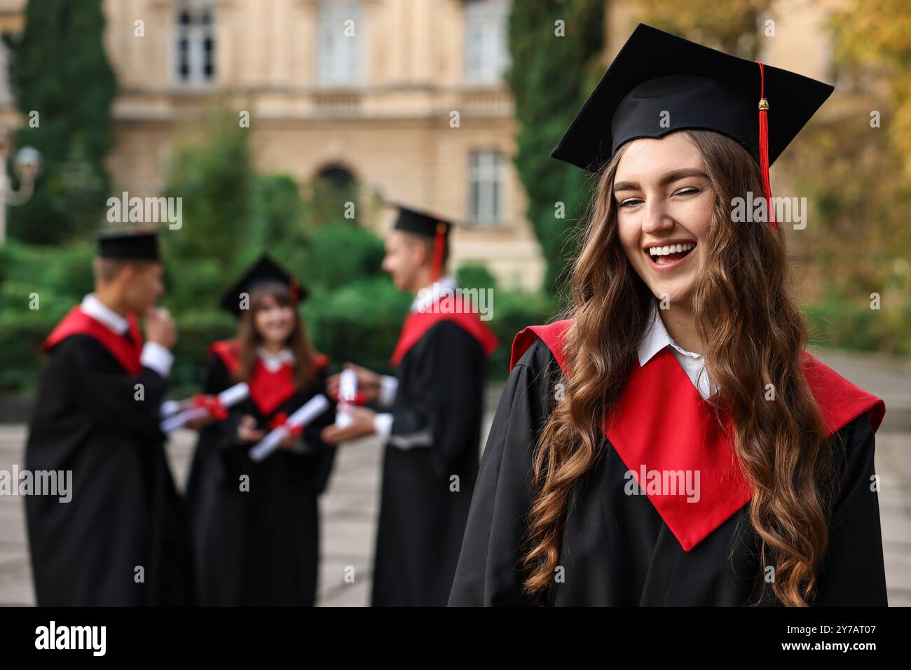 Graduation ceremony. Happy students outdoors, selective focus Stock ...