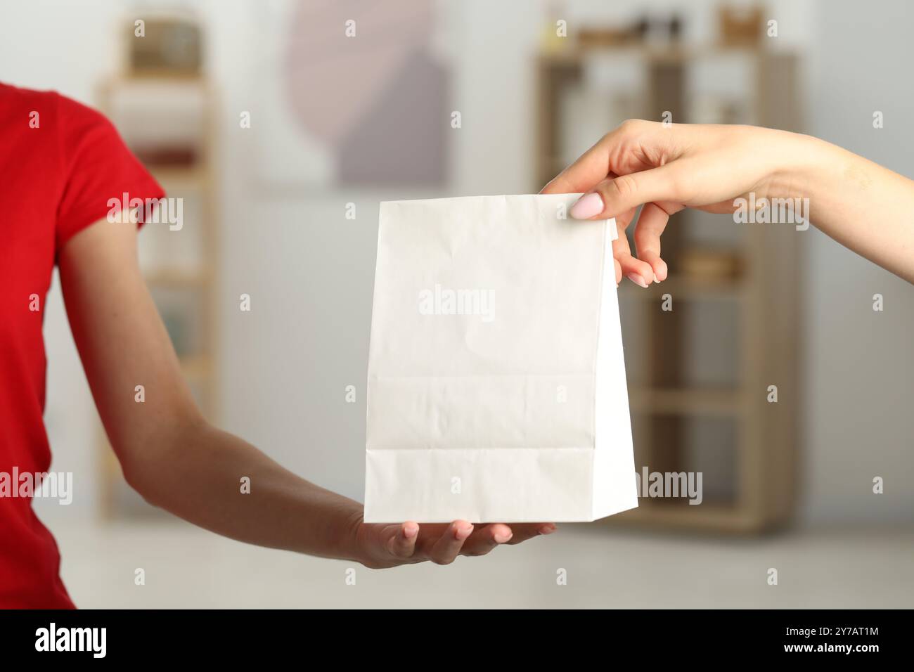 Fast-food worker giving customer's order indoors, closeup Stock Photo ...
