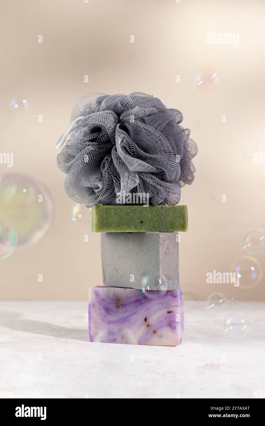 Minimalist still life with natural handmade soap and massage sponge ...