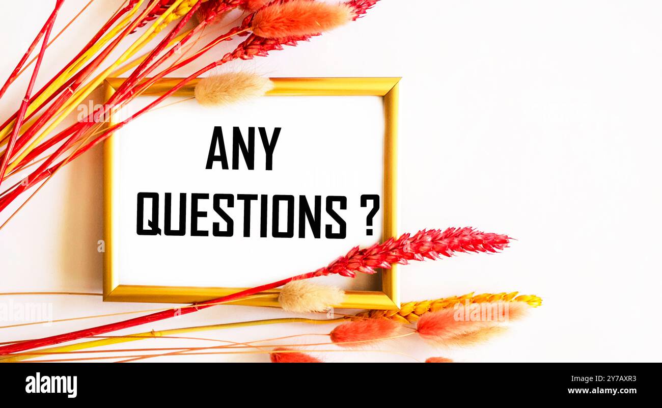 Text ANY QUESTIONS in a gold frame on a white background with an autumn ...